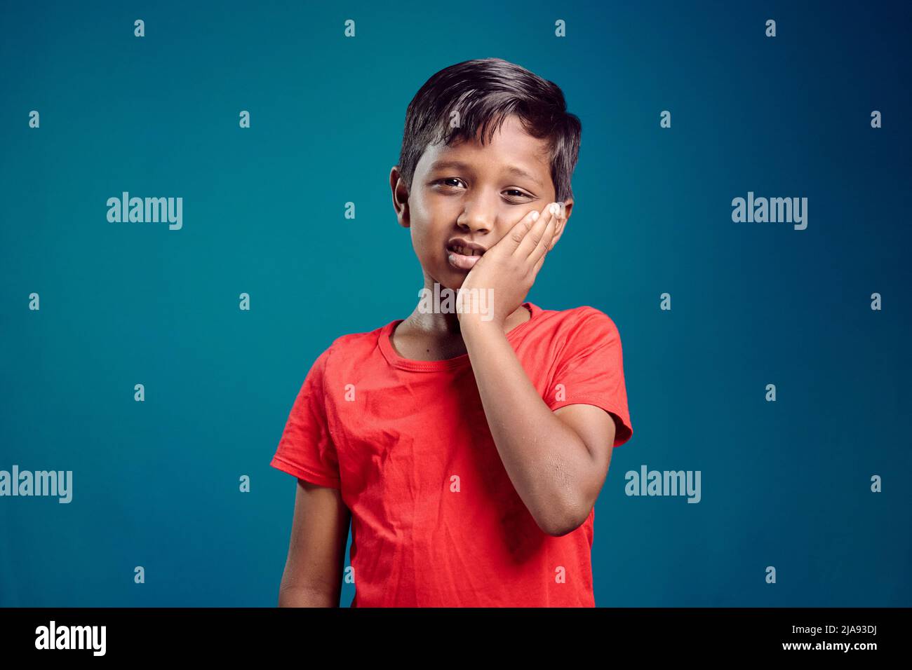 Little Asian boy suffering from toothache at home - . Asian boy 8-10 ...