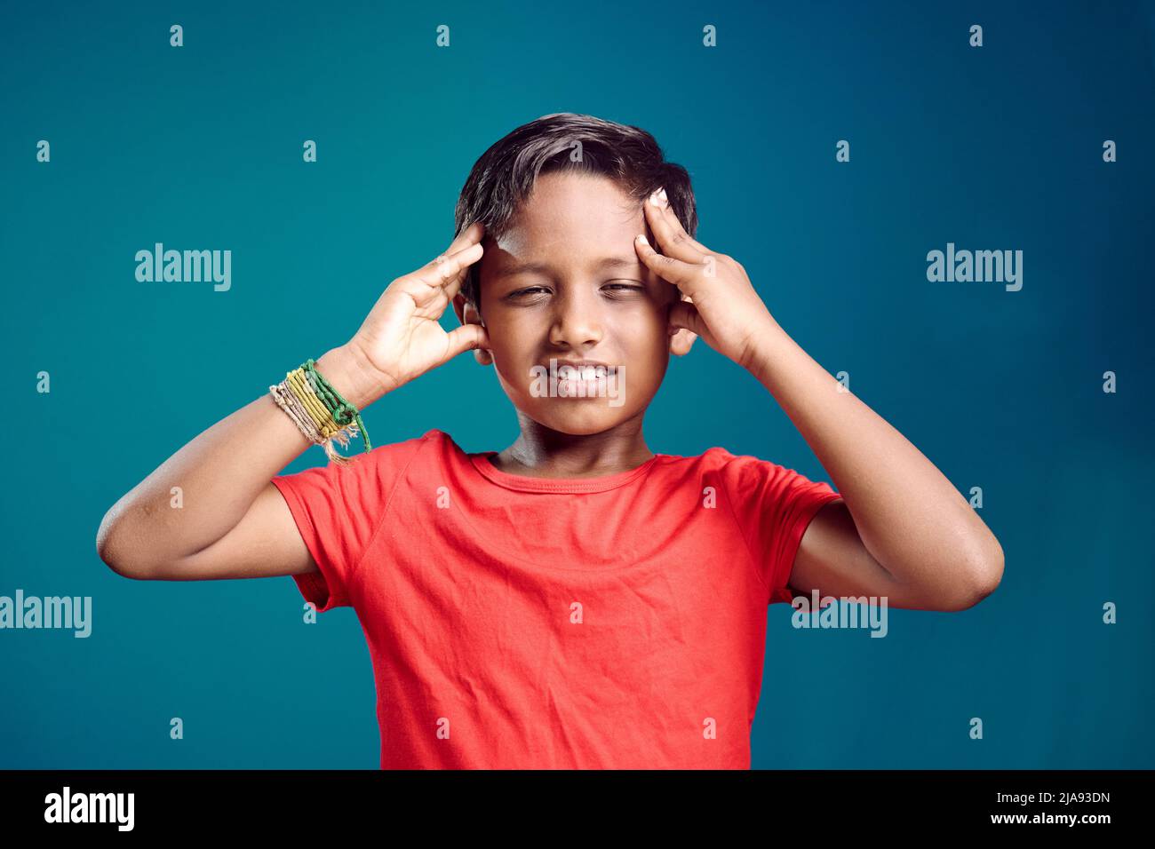 Closeup portrait stressed sad Asian boy with hands-on temples, head ...