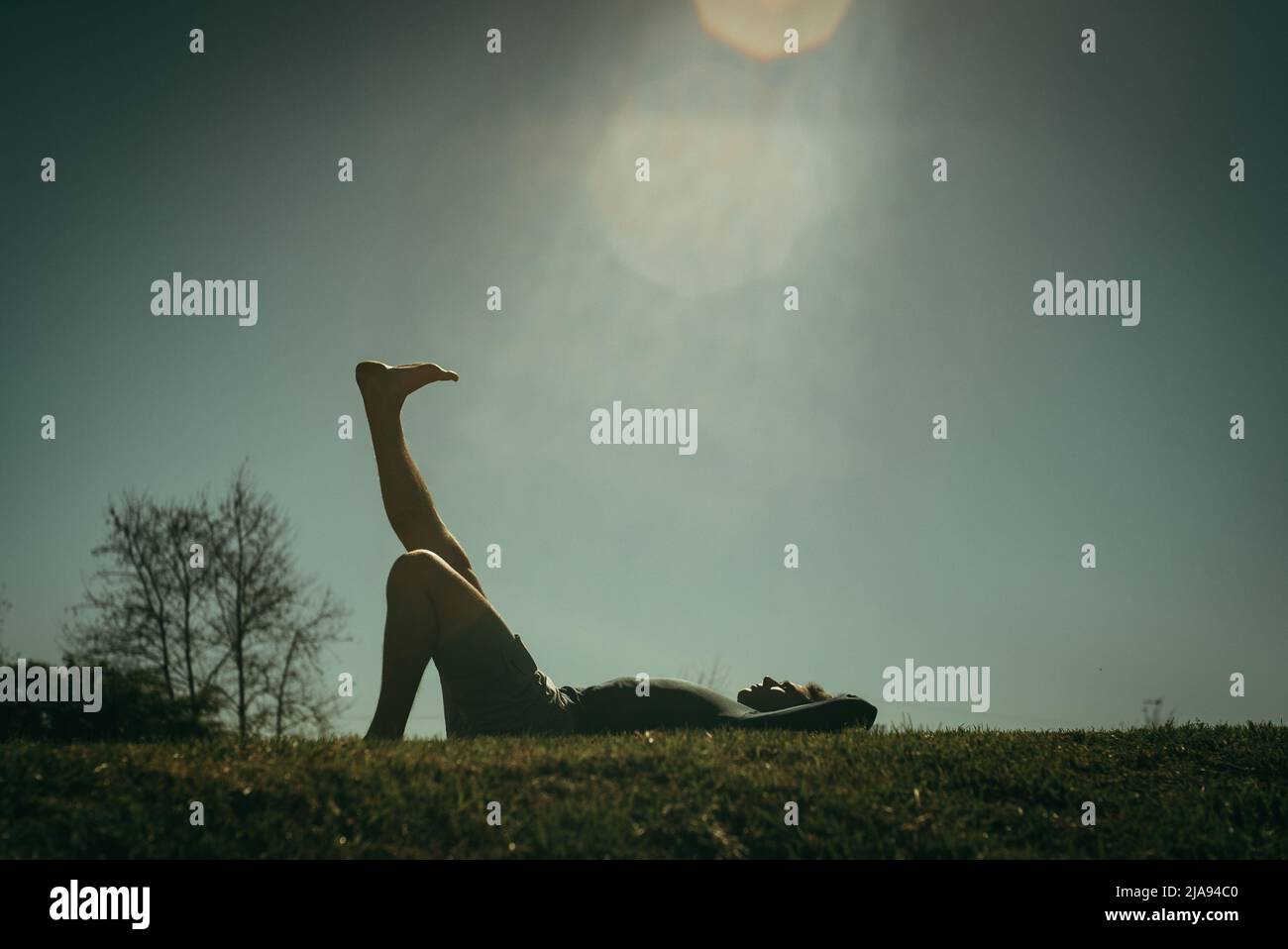Man laying down on sun hi-res stock photography and images - Alamy
