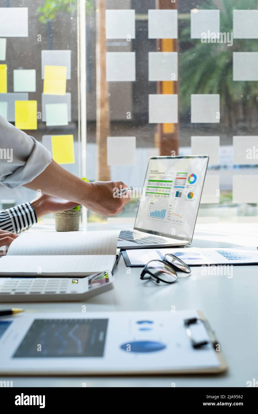 Asian Business people and Accountant checking data document for ...
