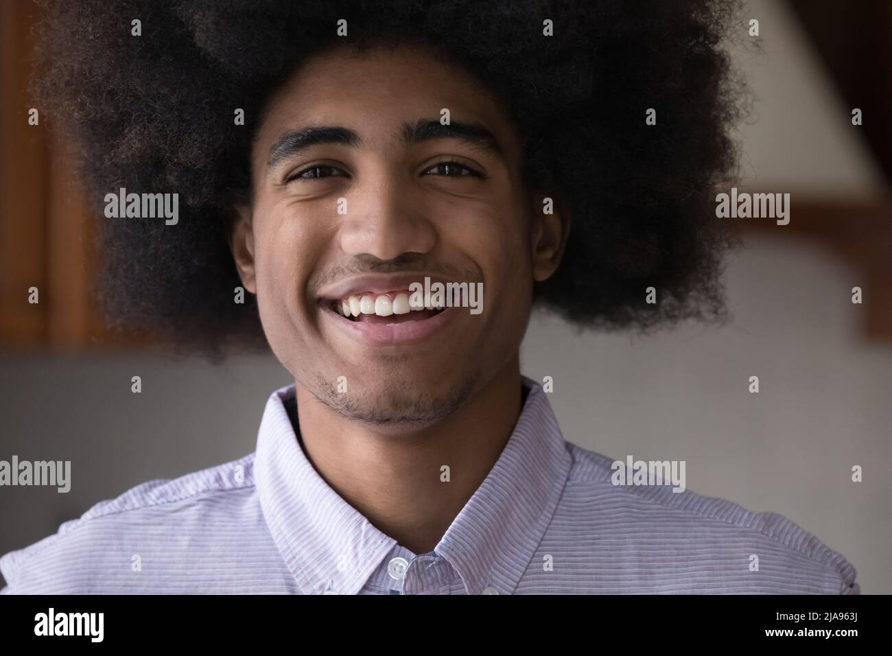 Happy cheerful African young man indoor head shot portrait Stock Photo ...