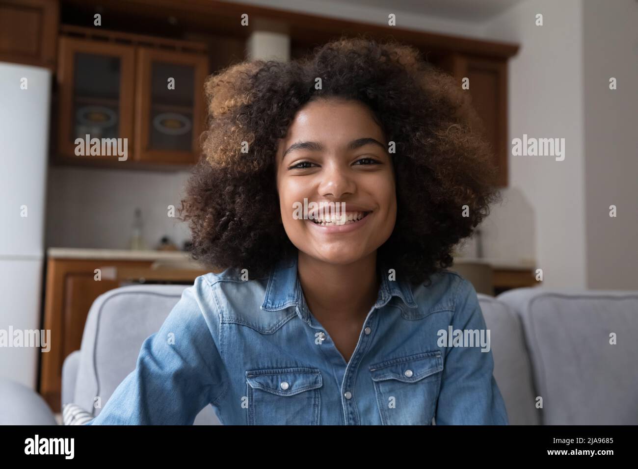 Black woman sitting hi-res stock photography and images - Alamy