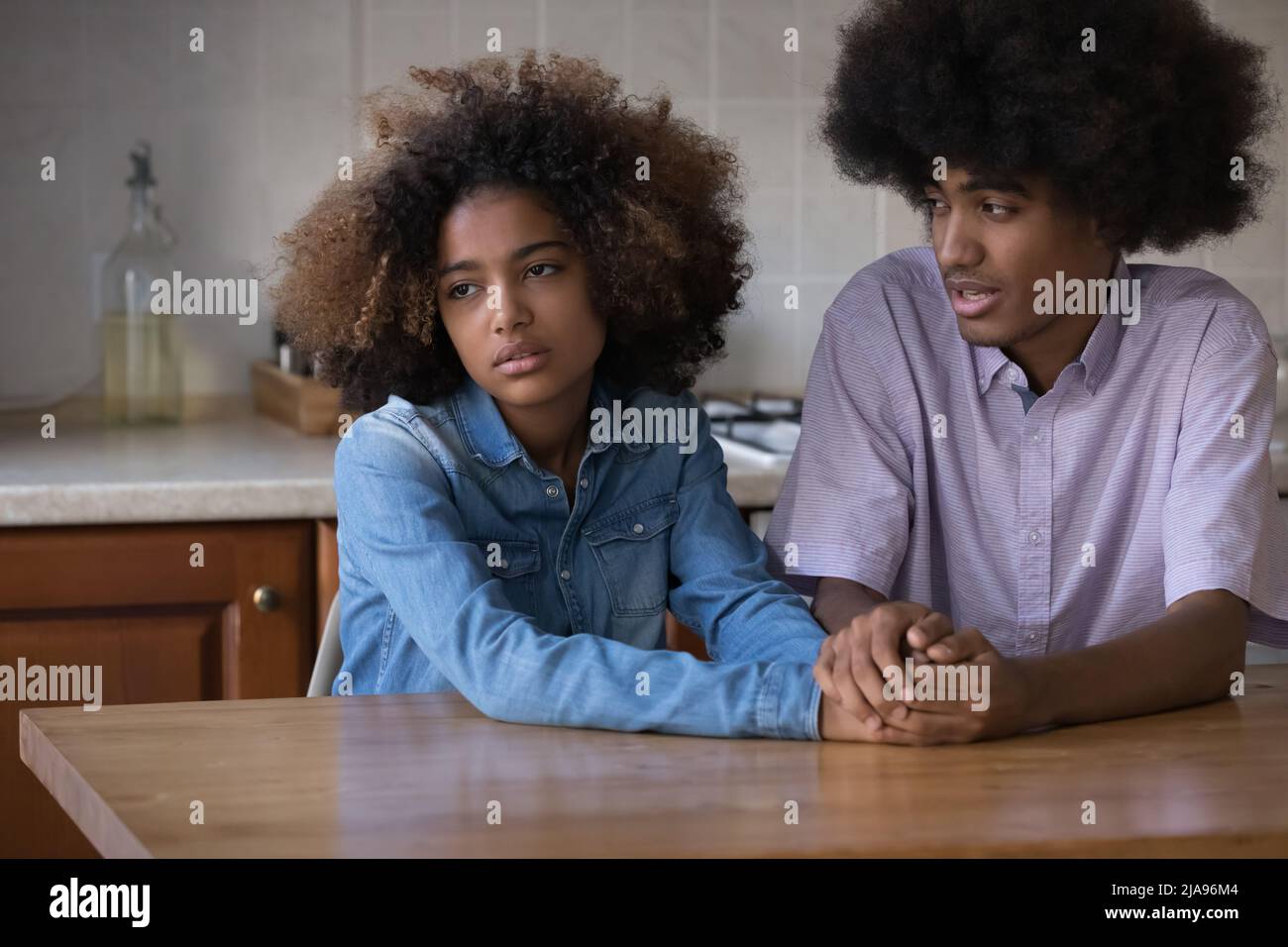 Teen loving Black guy giving comfort, support, compassion to girlfriend ...