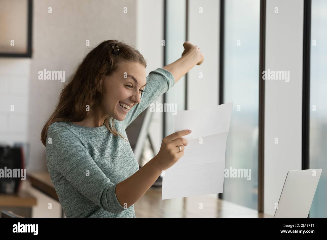 Happy excited student girl reading paper letter with good news Stock ...