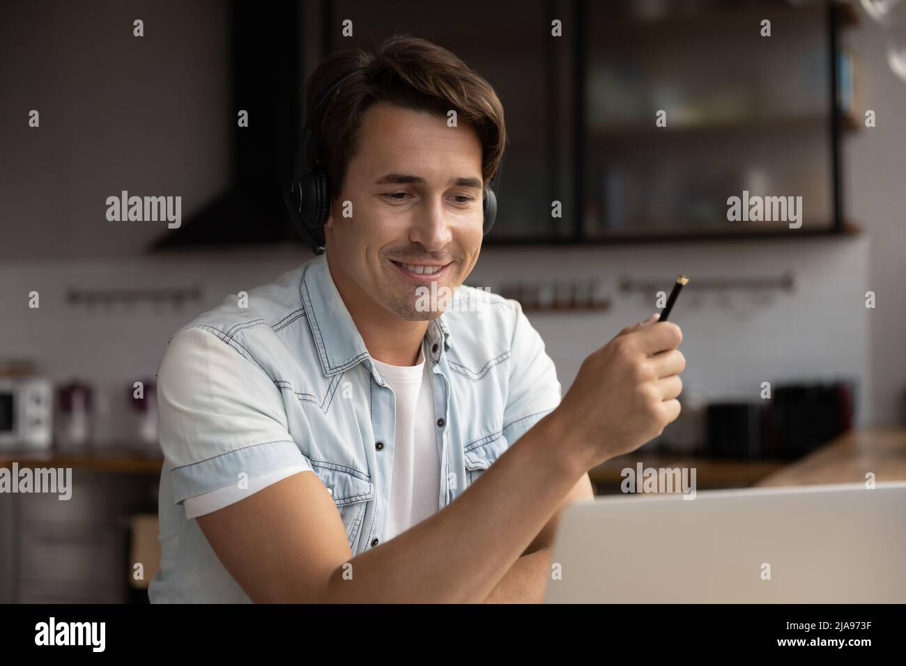 Adult remote student in headphones attending virtual lesson Stock Photo ...