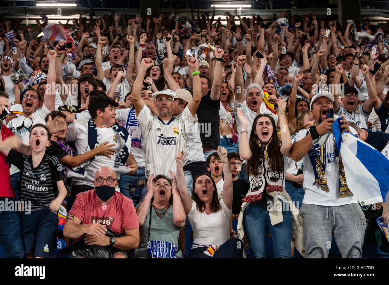 Real Madrid fans celebrate a goal as they watch live on large screens ...