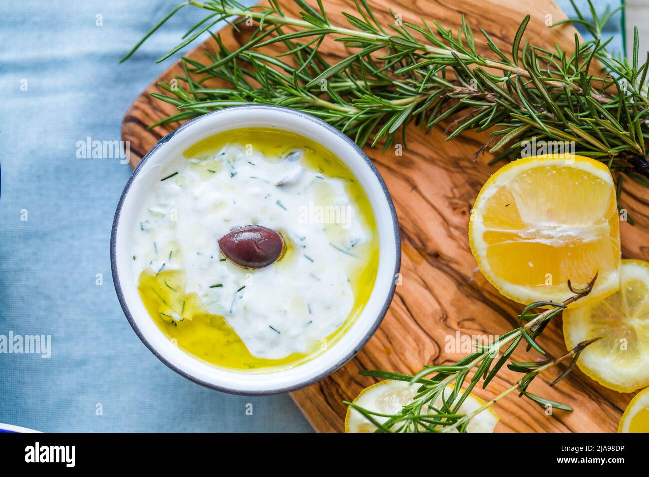 Typical Greek snack consisting of tzatziki sauce with cucumber, olives ...