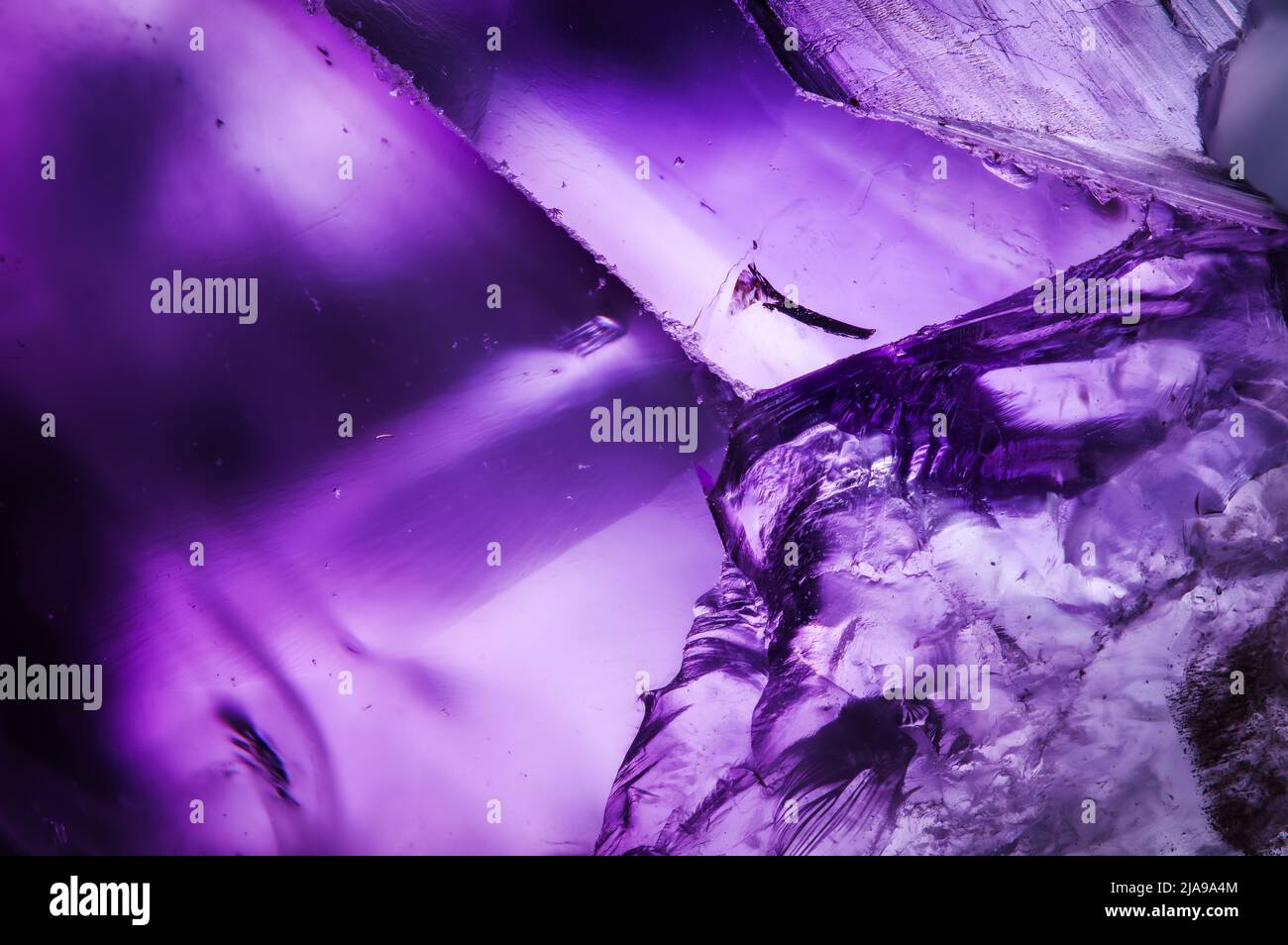 Amethyst rough crystal black background Stock Photo - Alamy
