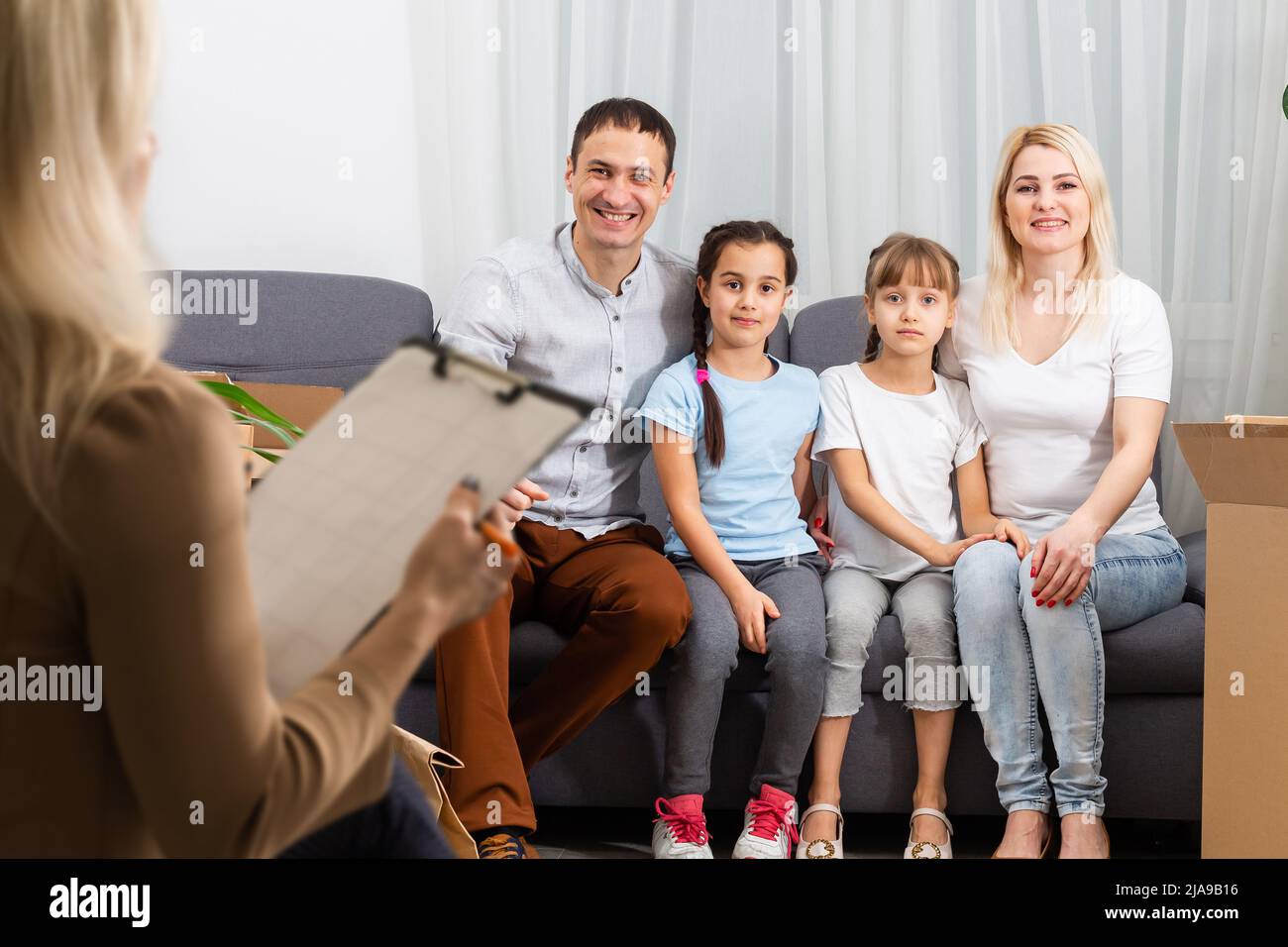 Hand of a professional family psychotherapist writing notes in front of ...