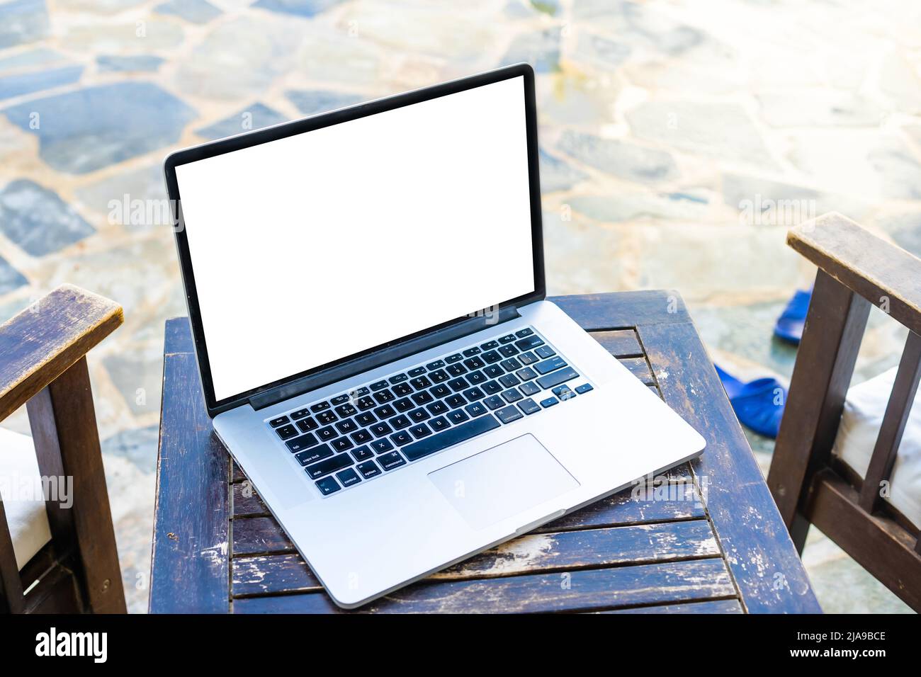 grey laptop computer open with keyboard on wooden deckchair Stock Photo ...