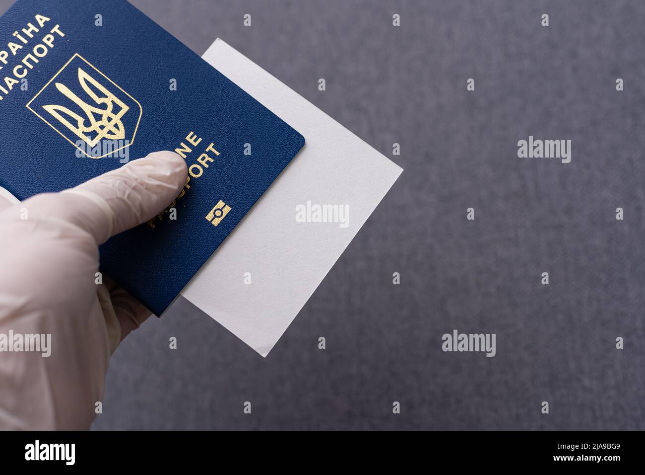 Ukrainian biometric passport with the inscription UA-EU on a white ...