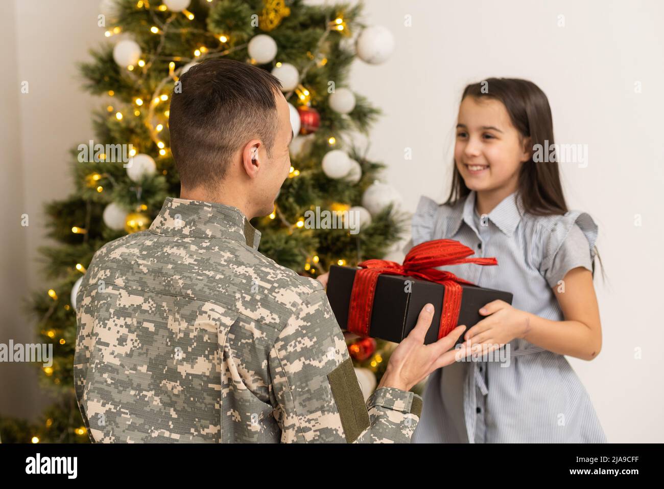 Military Man and his daughter for christmas Stock Photo - Alamy