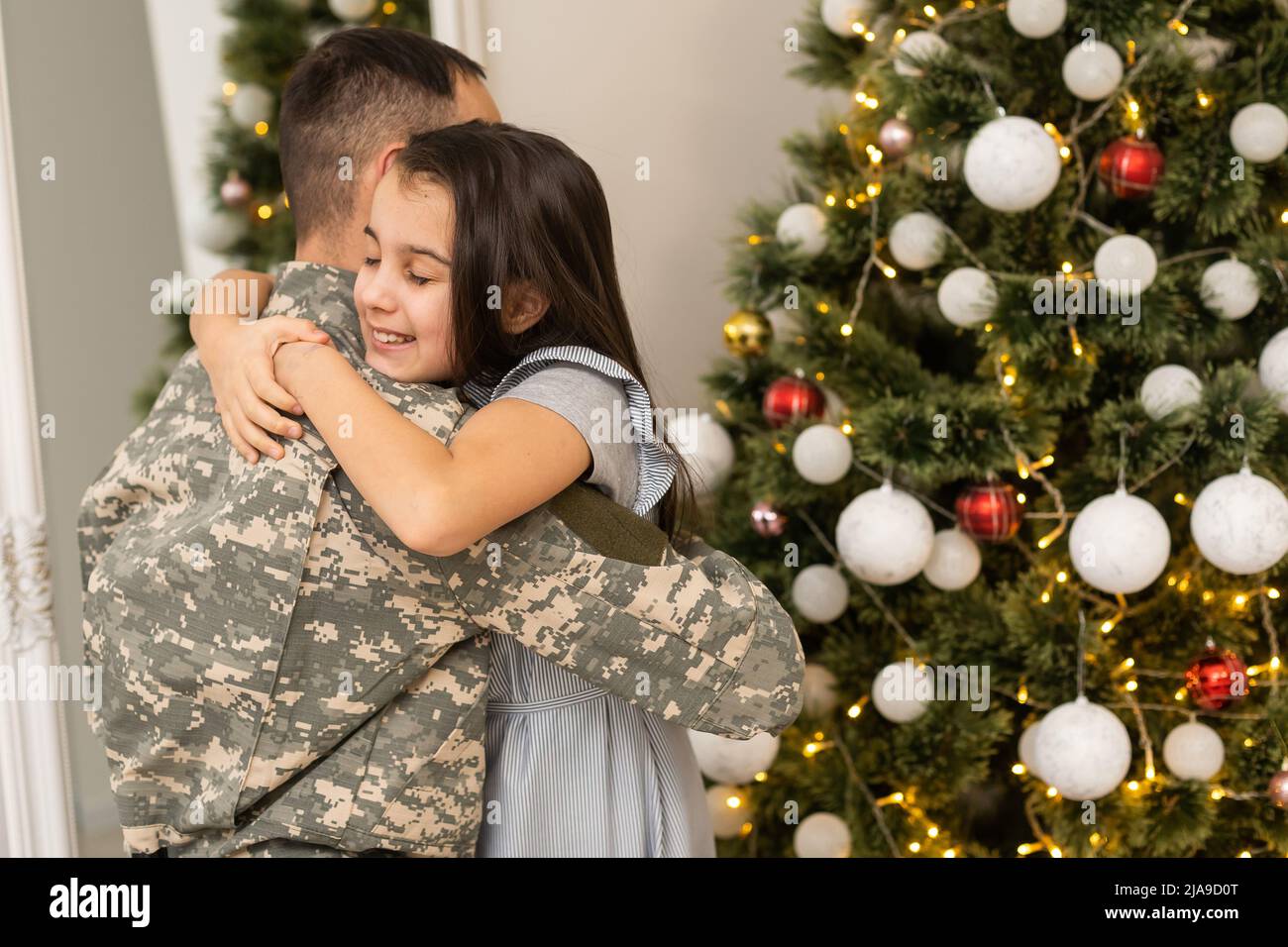 Military Man and his daughter for christmas Stock Photo - Alamy