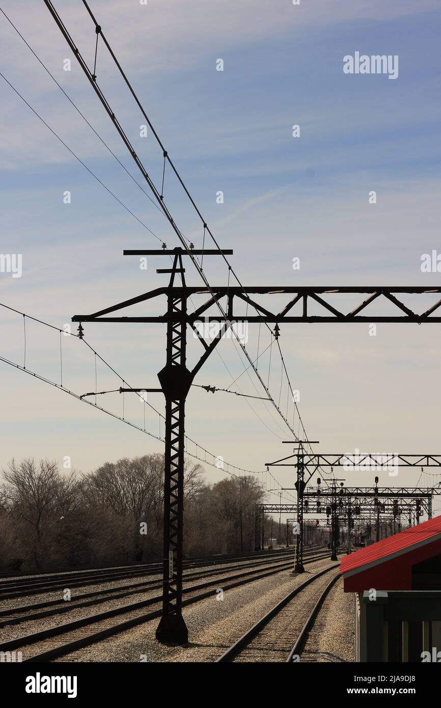 Power lines marching along the typical railroad tracks Stock Photo - Alamy