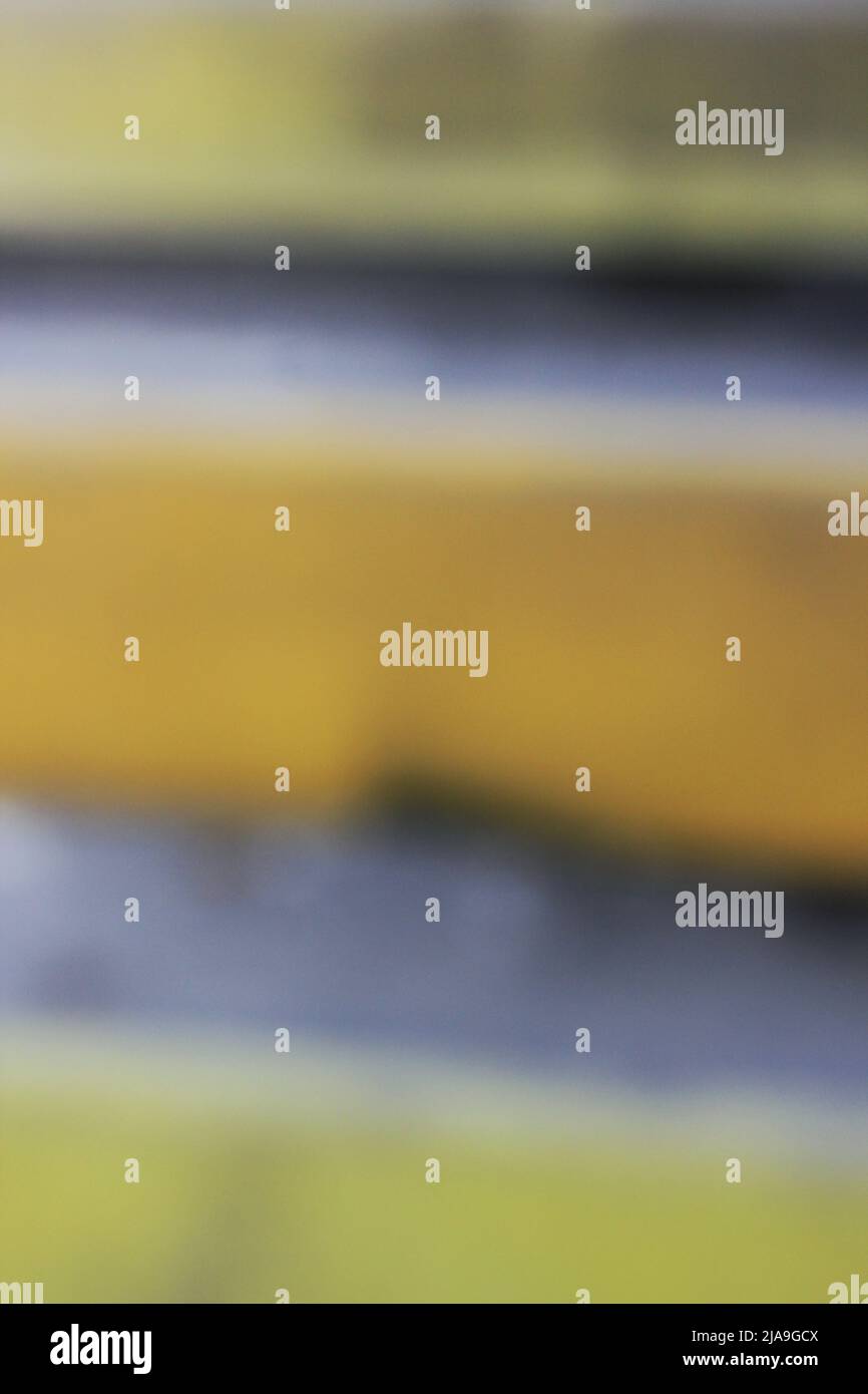 Bold blurry and dreamy bright yellow horizontal lines crossing the page ...