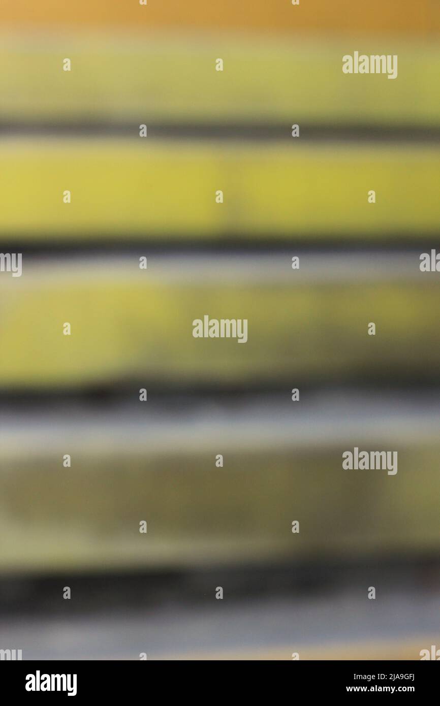 Bold blurry and dreamy bright yellow horizontal lines crossing the page ...