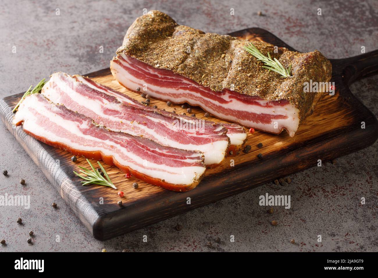Pancetta Italian is a salt cured pork belly salume closeup on the ...