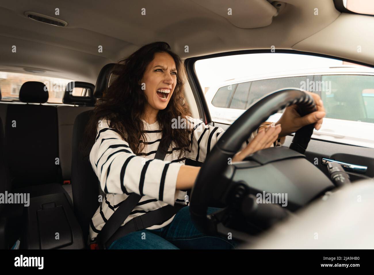 Woman honking car horn hi-res stock photography and images - Alamy