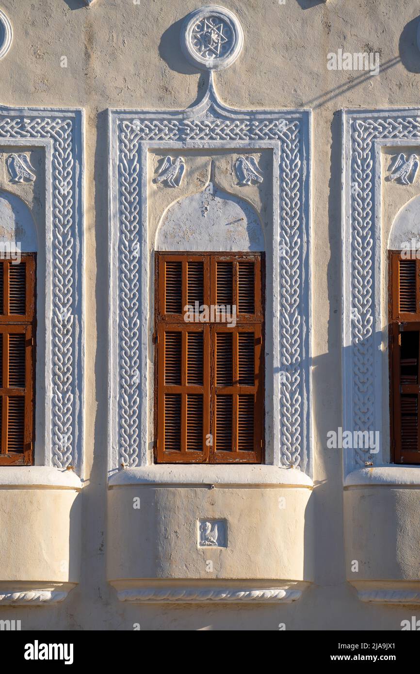 Wooden antique windows with arched shape on a painted old wall Stock ...
