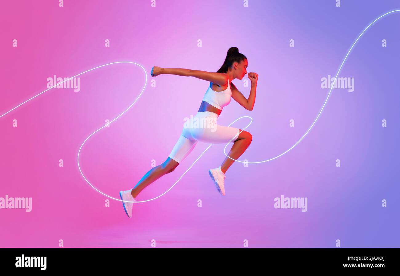 Female Runner With Neon Light Line Running In Mid-Air, Studio Stock ...