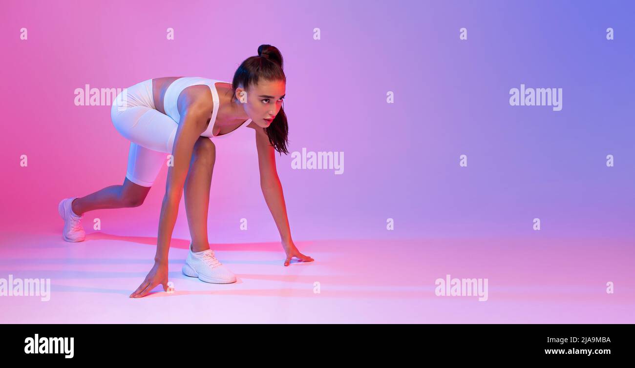 Runner Woman Doing Crouch Start Over Neon Pink Background, Panorama ...