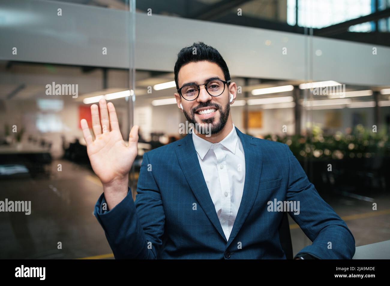 Happy handsome millennial muslim businessman with beard in glasses in ...
