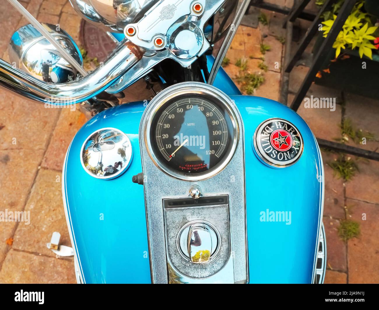 Blue bright tank with a motorcycle speedometer with logo and the ...