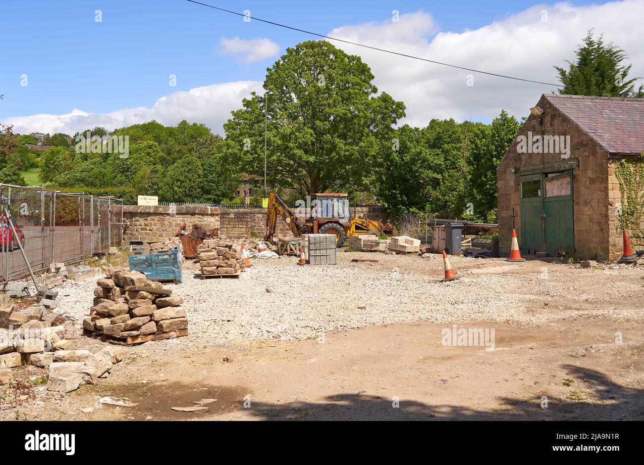 Digger on a rural building site in Matlock, UK Stock Photo - Alamy