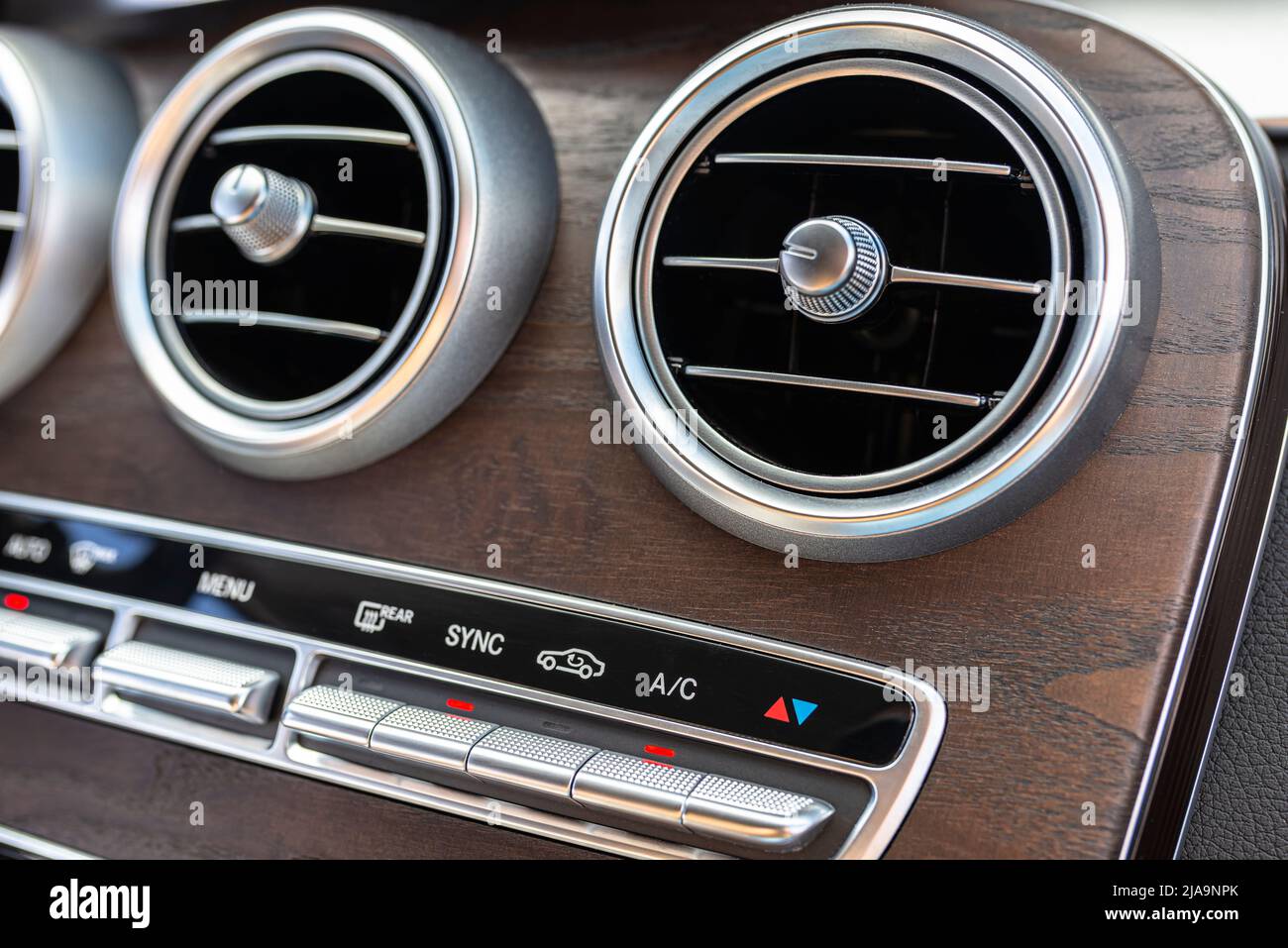 The interior of a modern passenger car with three vents visible and air ...