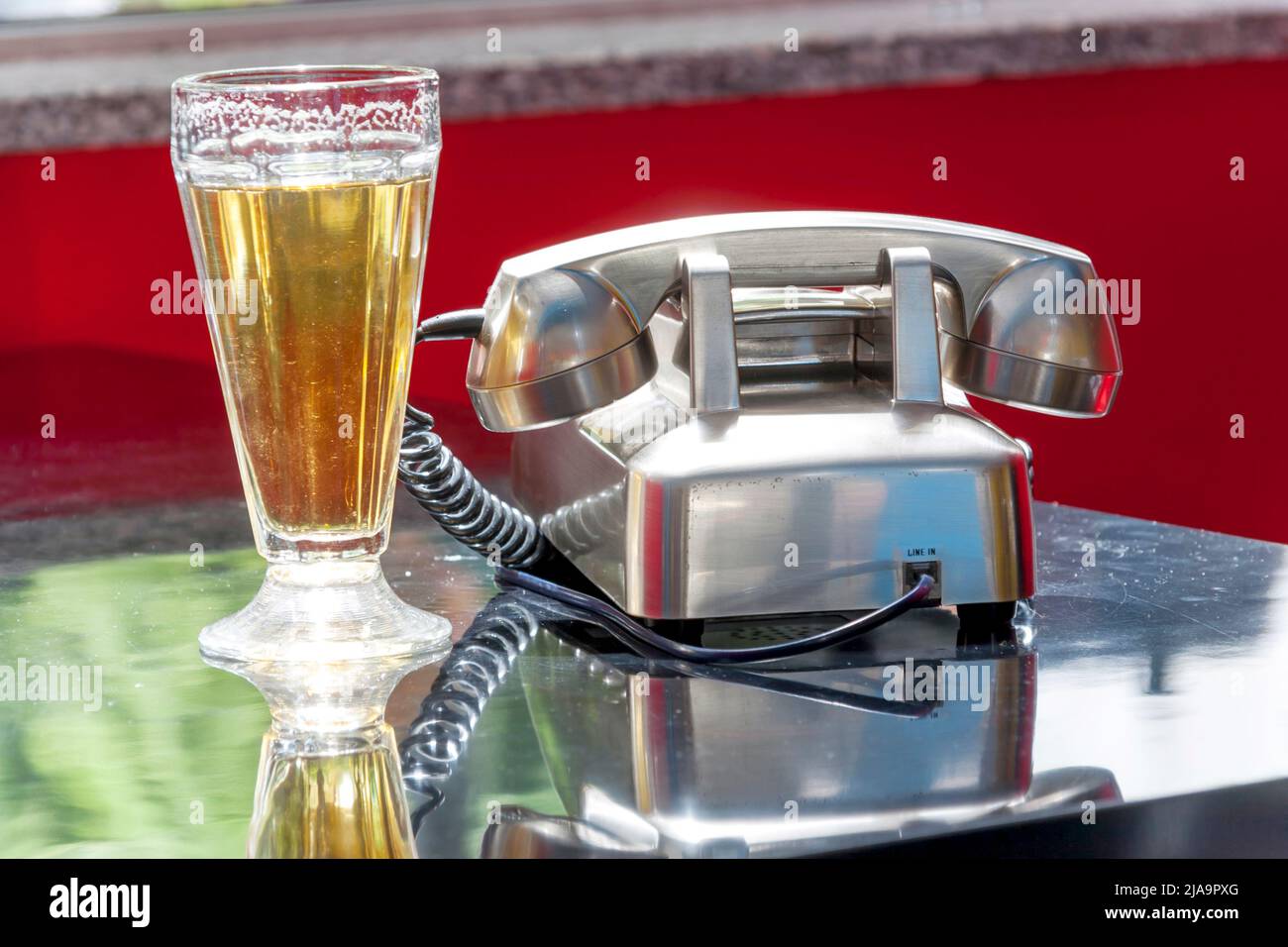 close up of vintage telephone and beer in a bar Stock Photo - Alamy