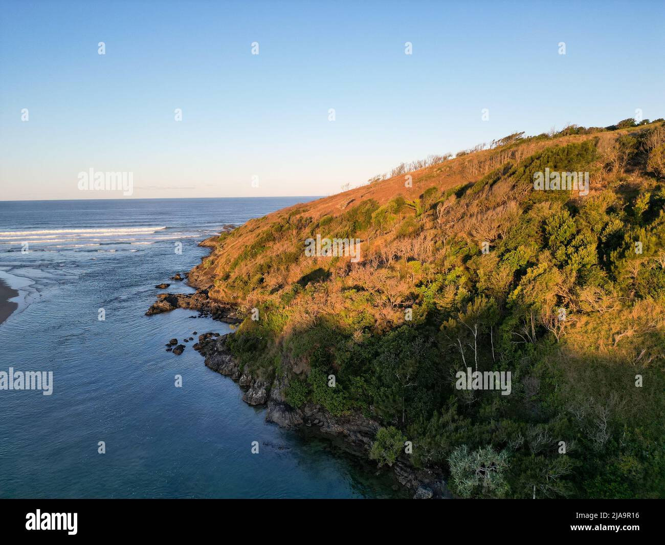 Aerial sunset view of inlet and hills Stock Photo - Alamy