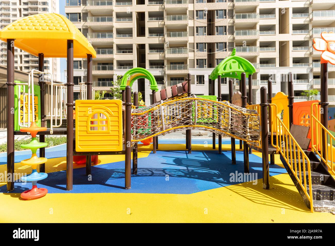 playground for children in residential buildings in a sunny morning ...