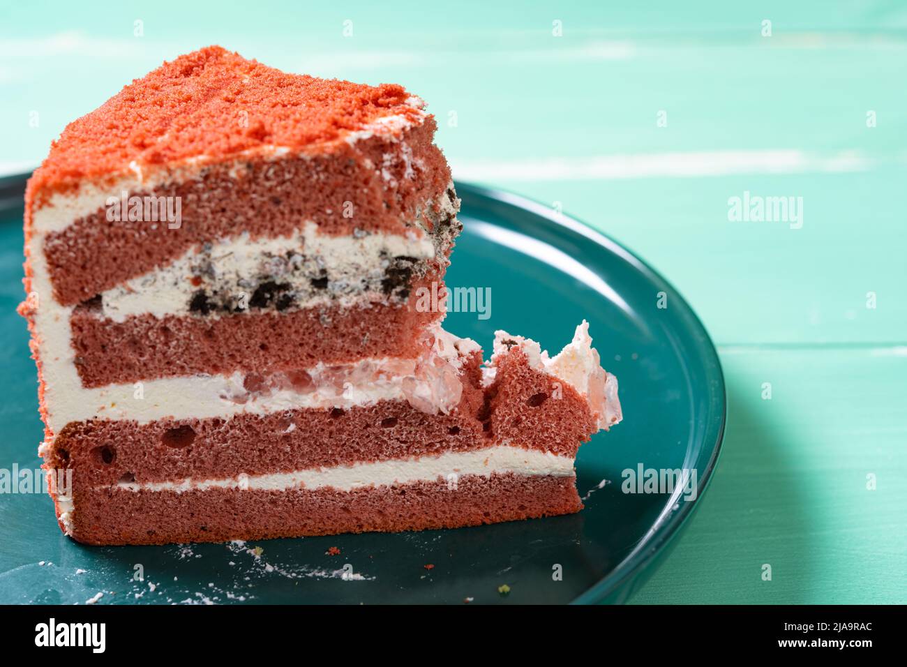 red color sweet cake with a bite Stock Photo - Alamy