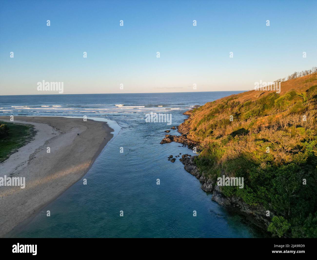 Aerial sunset view of inlet and hills Stock Photo - Alamy