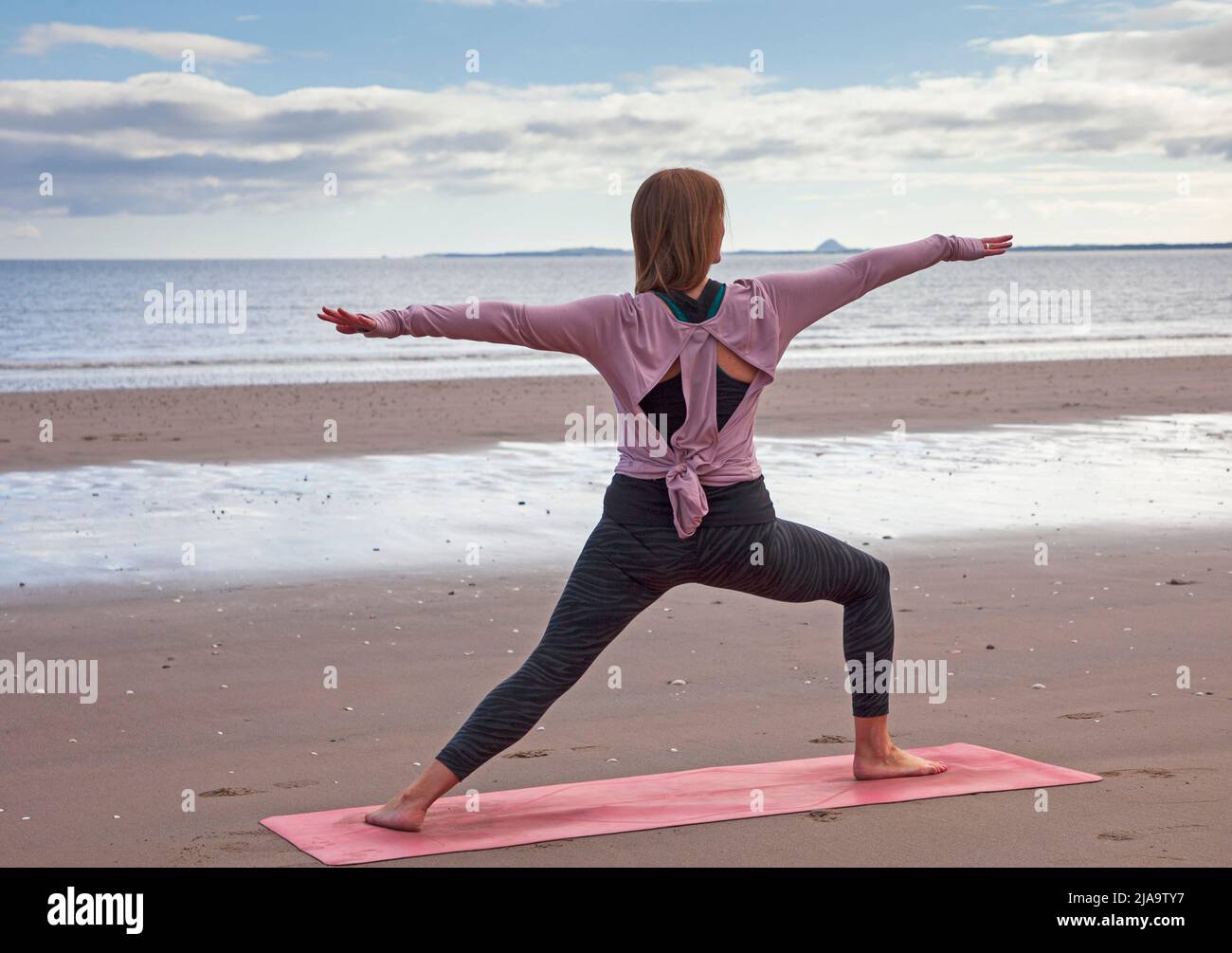 Portobello, Edinburgh Scotland, UK. 29th May 2022. yoga exercises on ...
