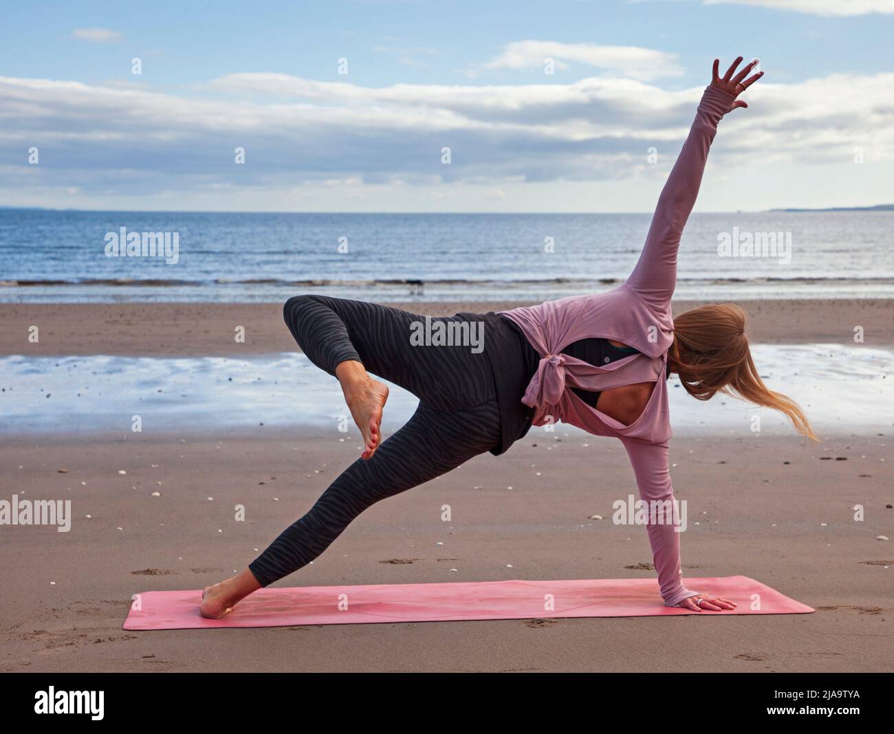 Portobello, Edinburgh Scotland, UK. 29th May 2022. yoga exercises on ...