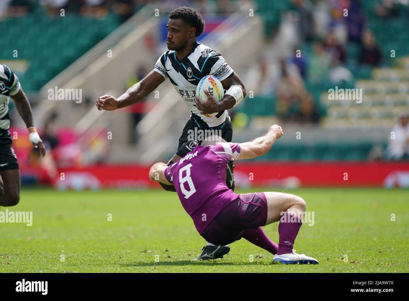 Fiji's Kaminieli Rasaku and England's Tom Bowen during match 29 on day ...