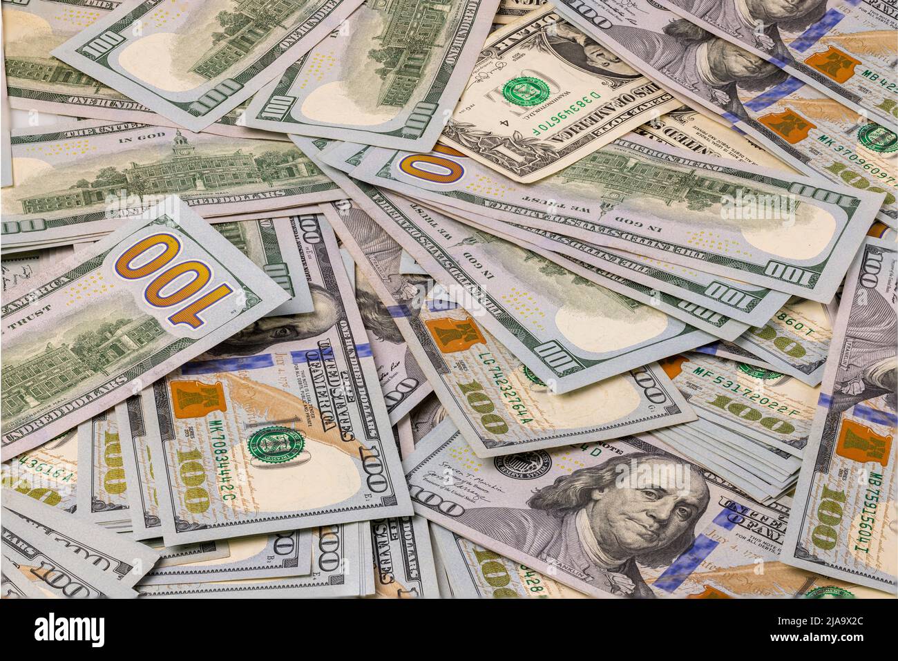 Close up view of scattered 100 dollar banknotes on background. Economy ...