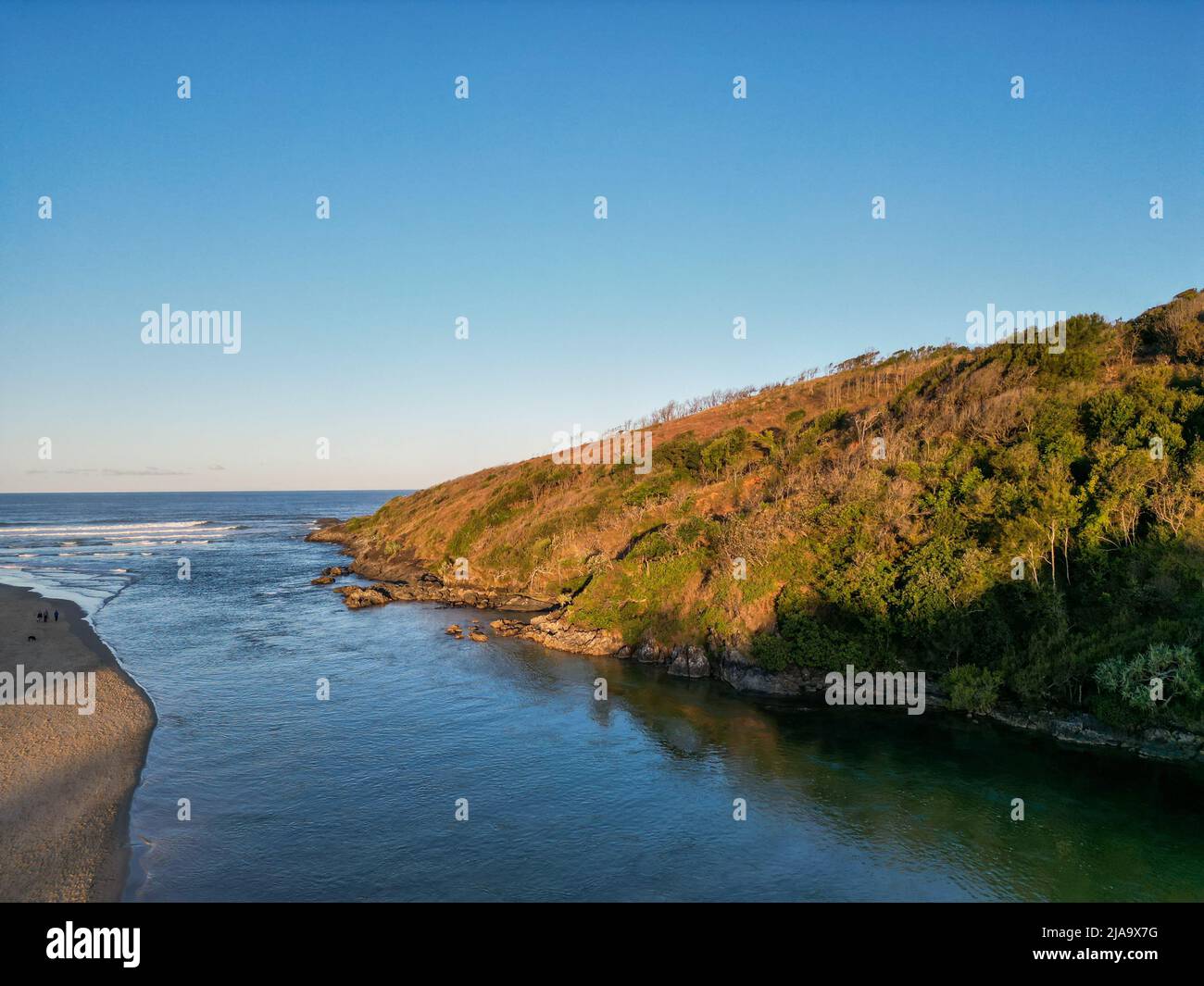 Aerial sunset view of inlet and hills Stock Photo - Alamy