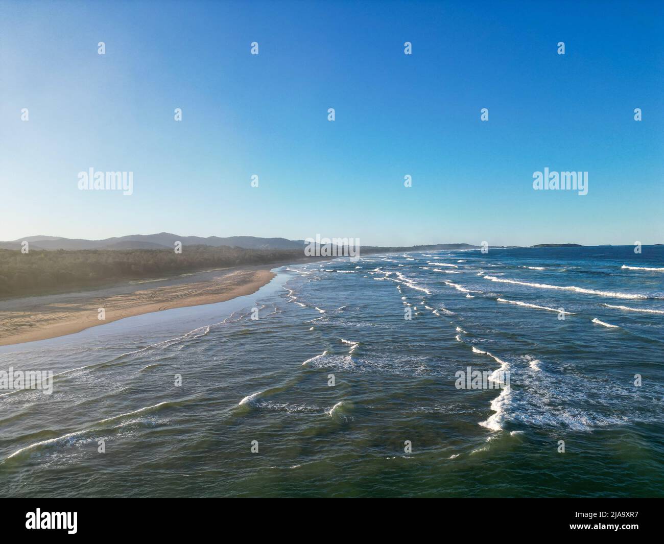 Aerial sunset view of ocean and hills in Stock Photo - Alamy
