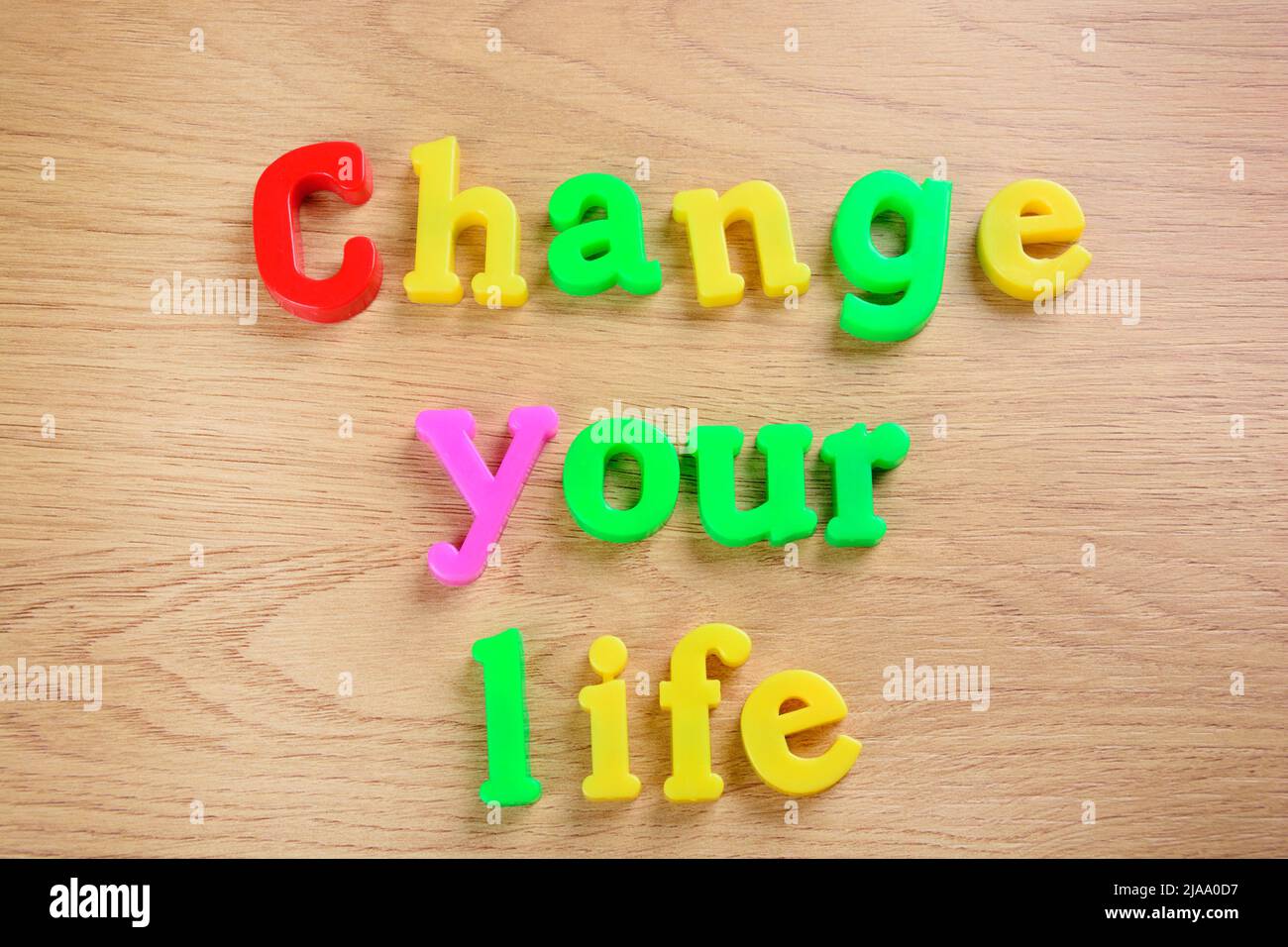 Change your life words on a wood table Stock Photo - Alamy