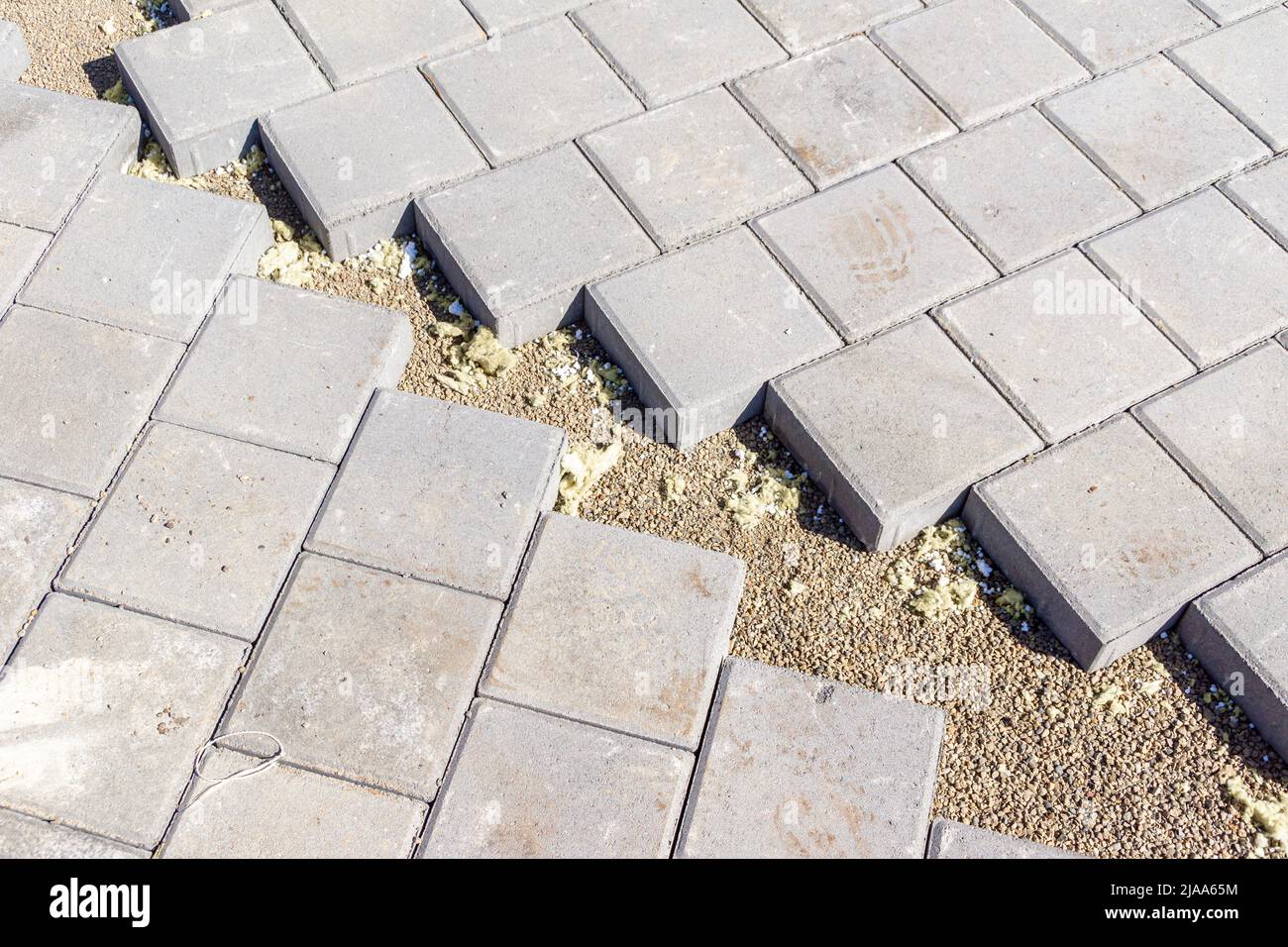 connection at an angle of two pedestrian paths paved with paving slabs ...