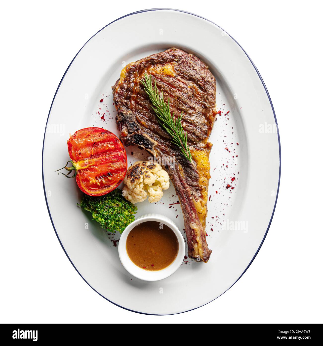 Isolated portion of grilled steak with vegetables Stock Photo - Alamy