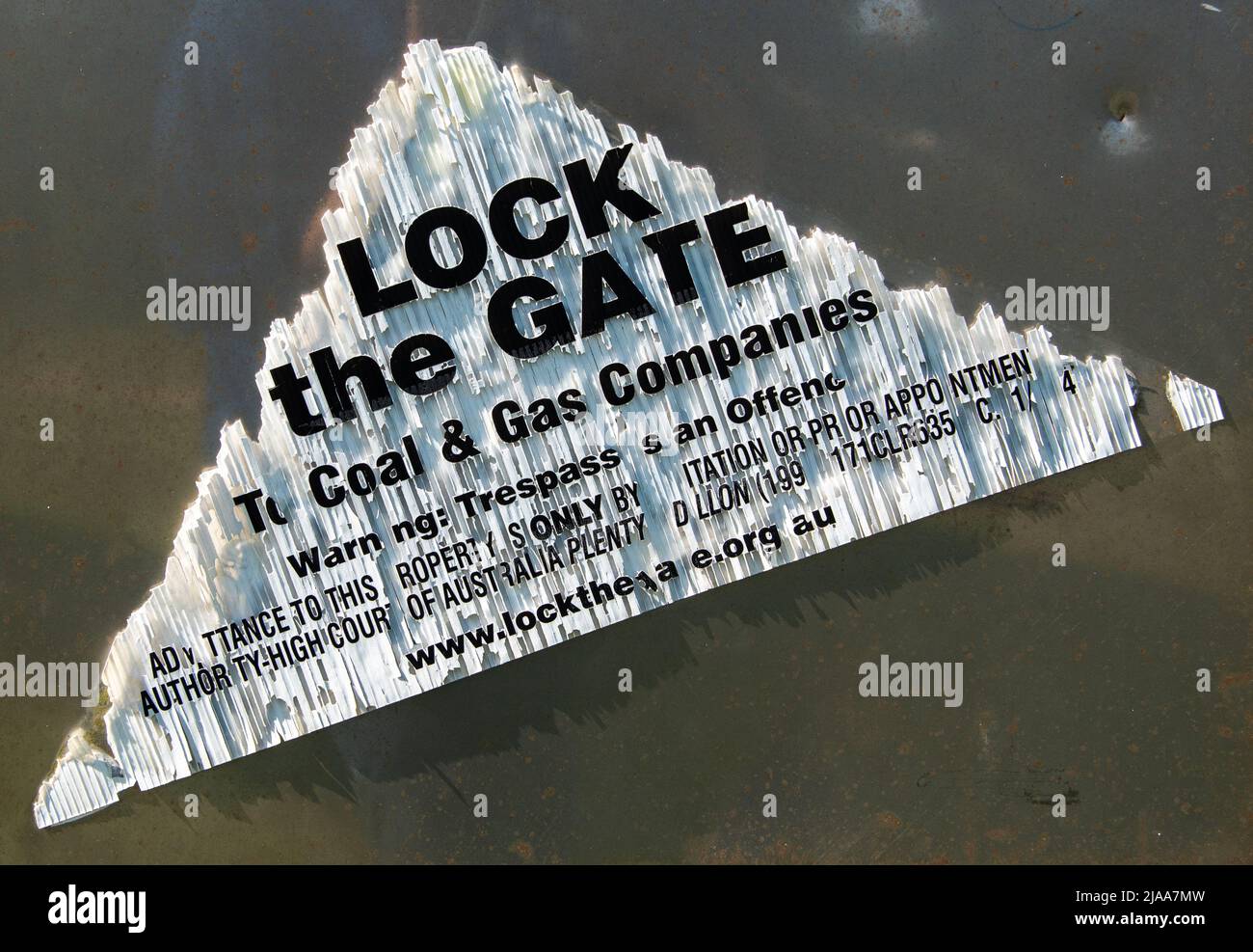 Dilapidated worn lock gate sticker on a metal surface Stock Photo - Alamy