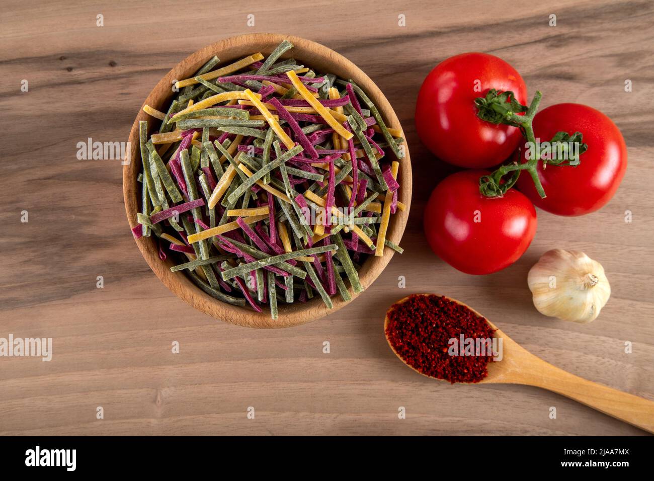 Traditional Turkish colors noodles with tomatoes, eggs and spices Stock ...