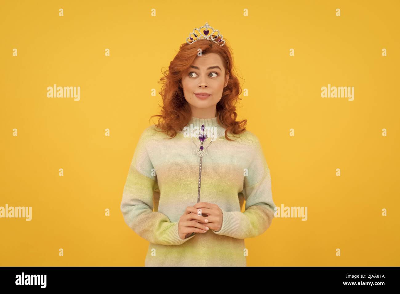 surprised redhead woman in queen crown with magic wand, magic Stock ...