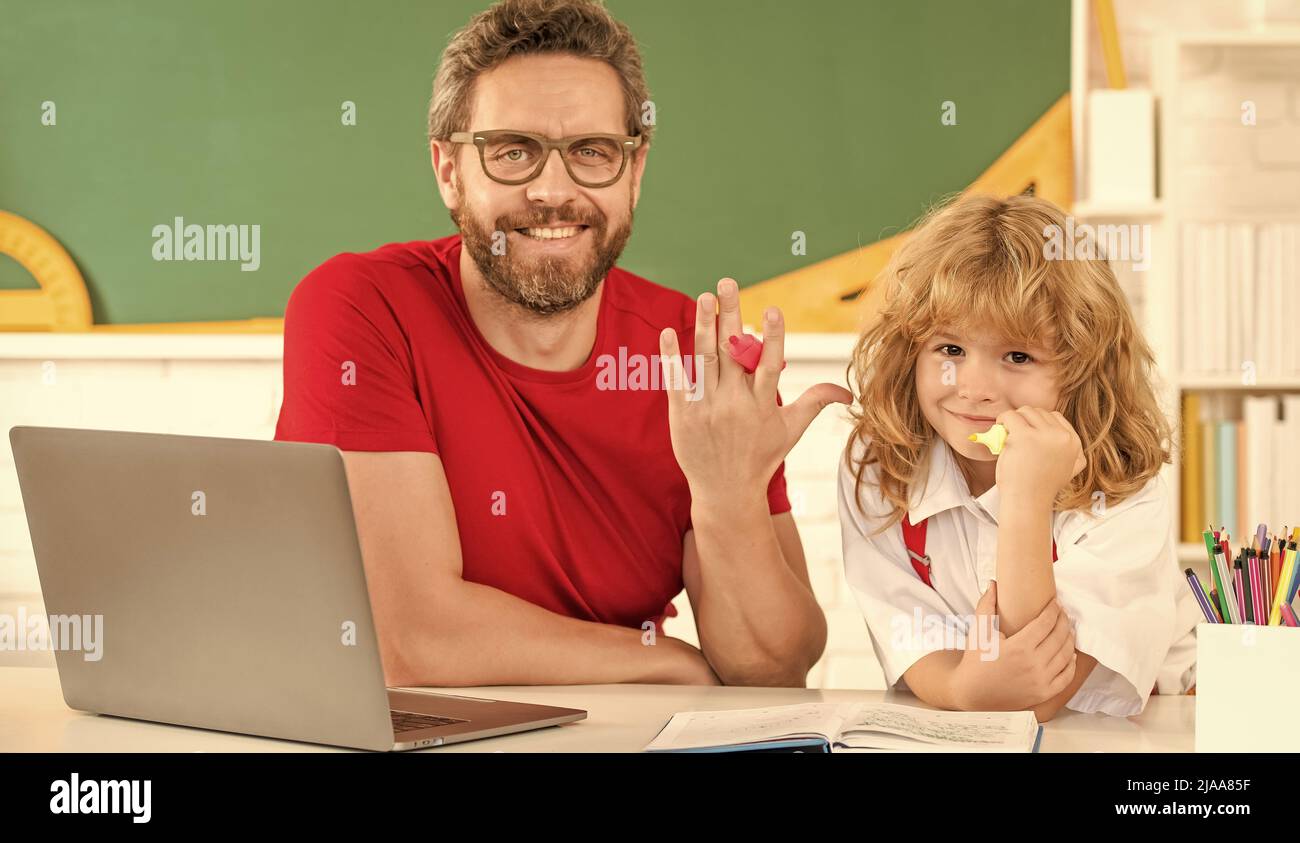 webinar video lesson. online education on laptop. father and son use ...