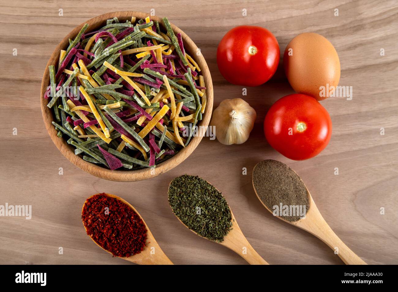 Traditional Turkish colors noodles with tomatoes, eggs and spices Stock ...