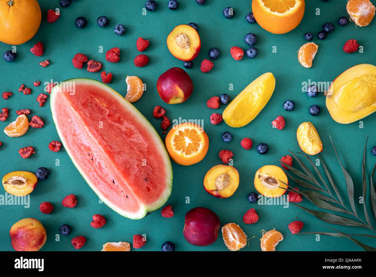Tropical fruits on a blue background, flat lay Stock Photo - Alamy