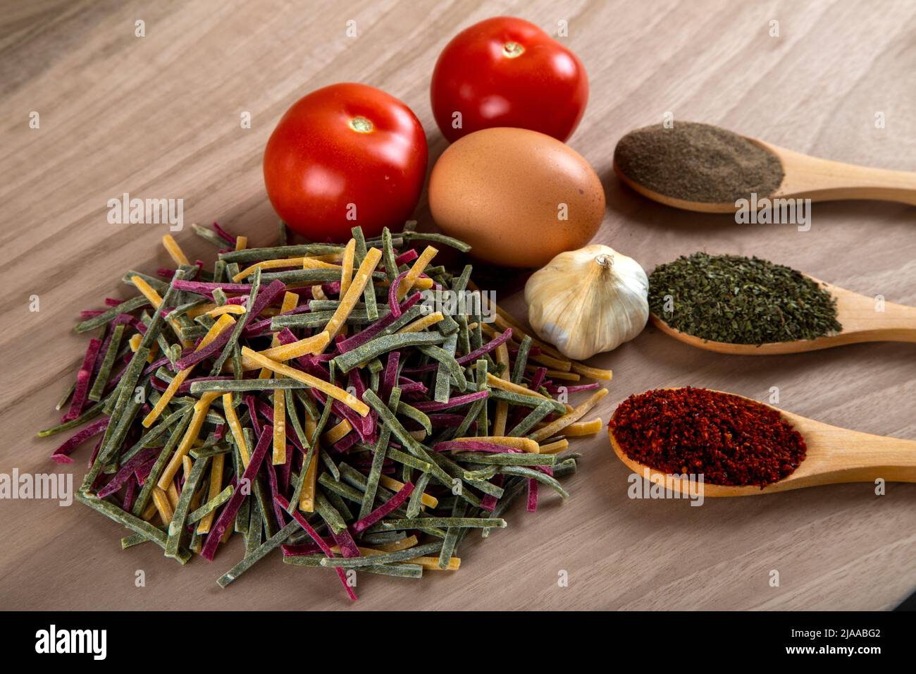 Traditional Turkish colors noodles with tomatoes, eggs and spices Stock ...